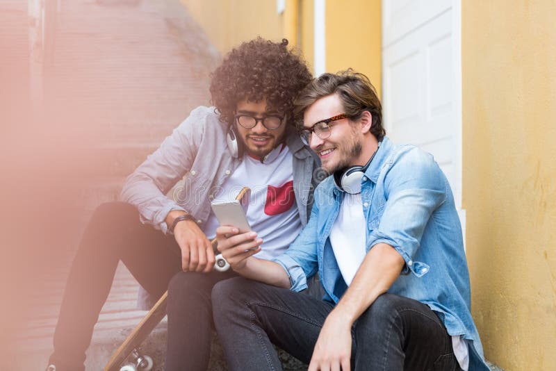 Friends using mobile phone stock photo. Image of lifestyle - 69801942