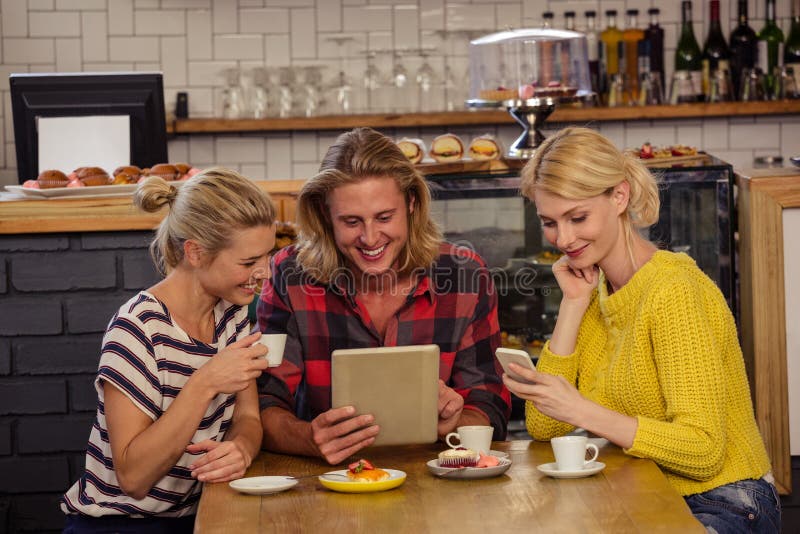 Friends using technology stock image. Image of business - 77689257