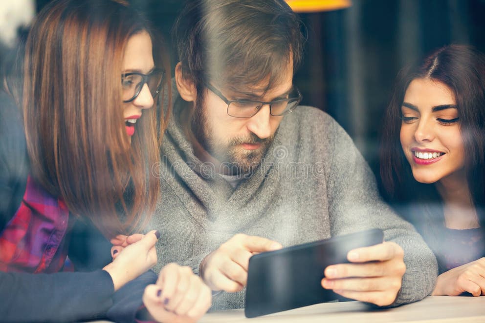 Friends Using Technology in Cafe Stock Photo - Image of male, caucasian ...