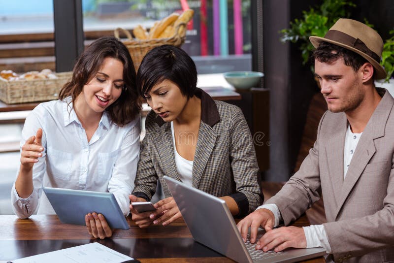 Friends using technology stock image. Image of mixedrace - 66981371