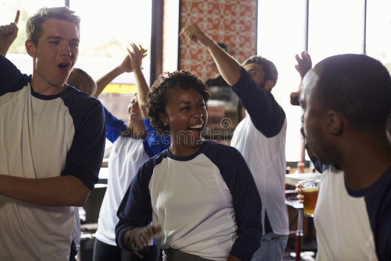Friends Watching Game in Sports Bar Celebrating Stock Image - Image of ...