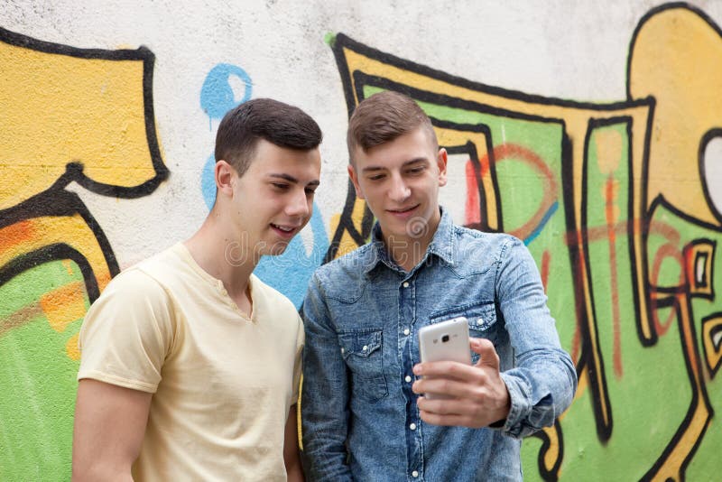 Friends Watching the Phone in the Street Stock Image - Image of fashion ...