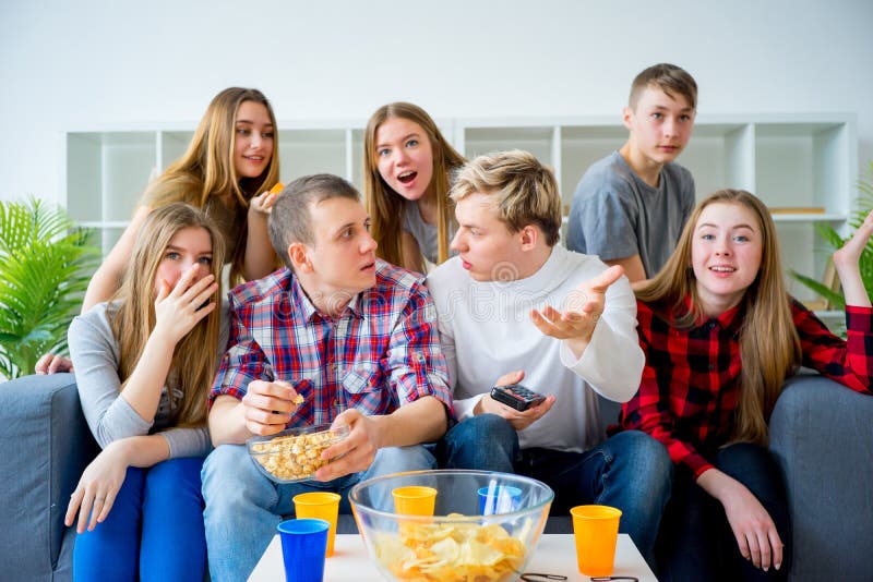 Friends watching TV stock image. Image of caucasian, couch - 90364833