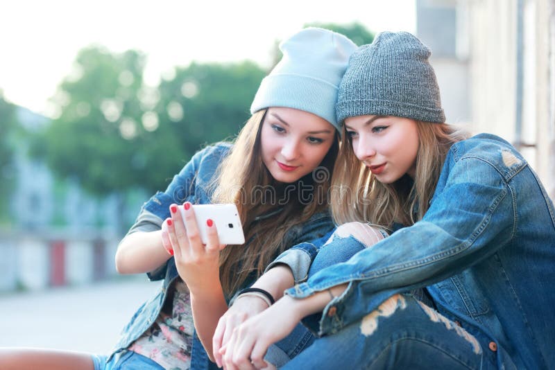 Friends watching videos stock photo. Image of network - 74346834