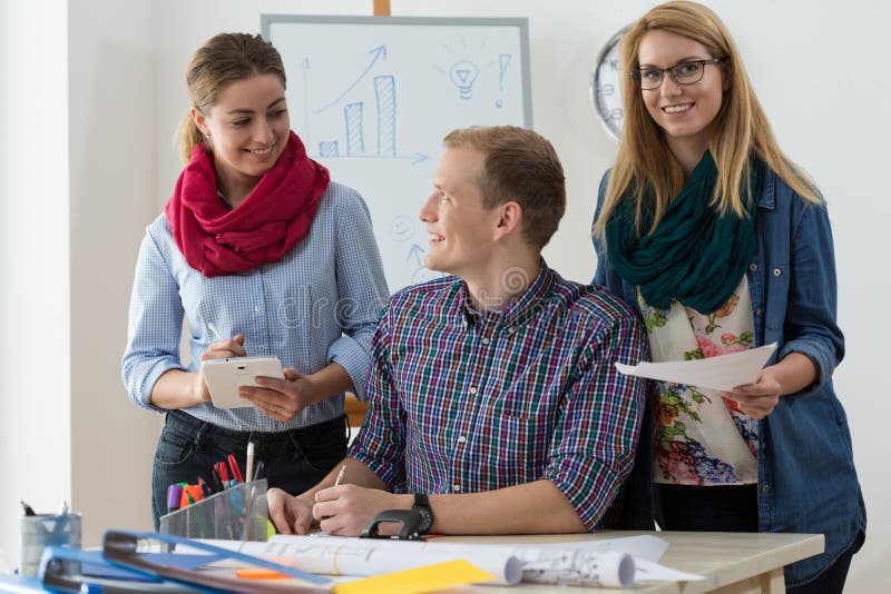 Friends Working Together at Office Stock Photo - Image of board ...