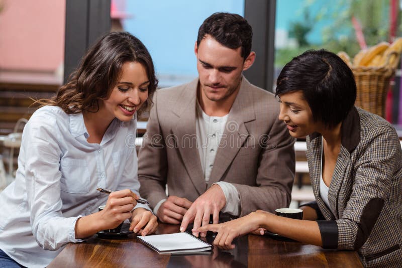 Friends Writing in a Notebook Stock Image - Image of adult, focused ...