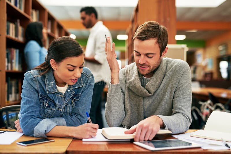 Friends, Writing or Students Reading Book in College for Education, Project or Study at ...