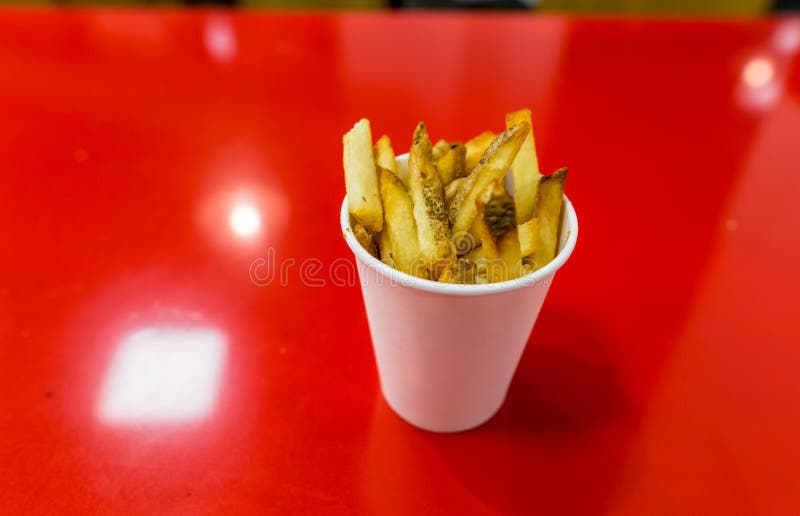 Fries in red restaurant stock image. Image of cook, cooking - 107593457