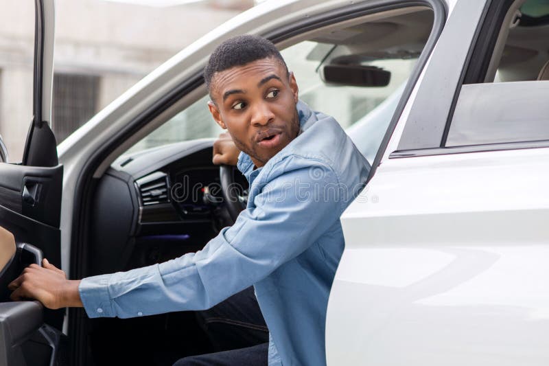 Frightened Black Man Opened the Door of His Car and Looking Back with ...