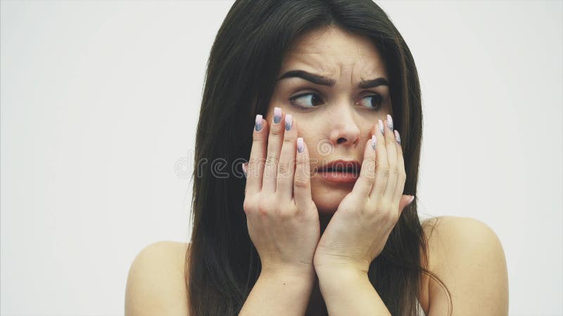 The Frightened Crazy Girl Got A Lot Of Stress Rubbing Her Fingers In Her Mouth Isolated On A