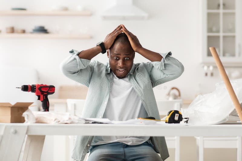 Frightened Handyman Having Problems in Assembling New Furniture ...