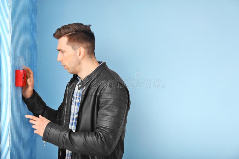 Frightened Man Using Fire Alarm System Indoors Stock Image - Image of ...