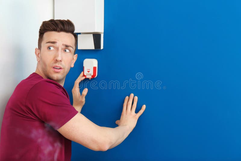 Frightened Man Using Fire Alarm System Indoors Stock Photo - Image of ...