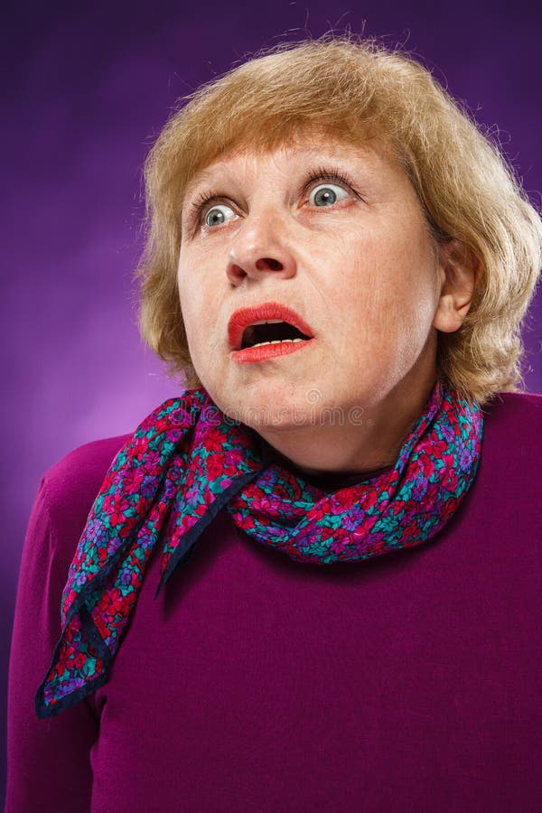 Frightened Senior Woman Screaming Against Blue Background Stock Image ...