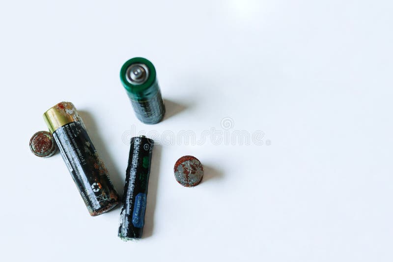Leaking and Corroded Used Batteries on White Surface Stock Image ...