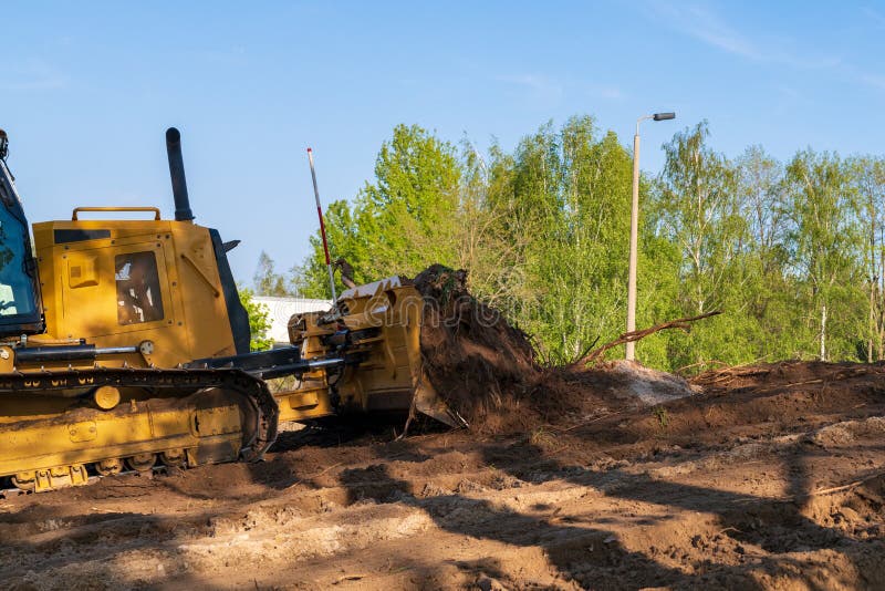 A bulldozer at work stock image. Image of clearing, topsoil - 146559655