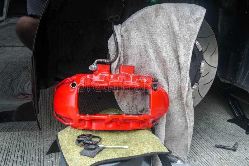 Front Brake Calipers at the Front Tire of the Car Stock Photo - Image ...