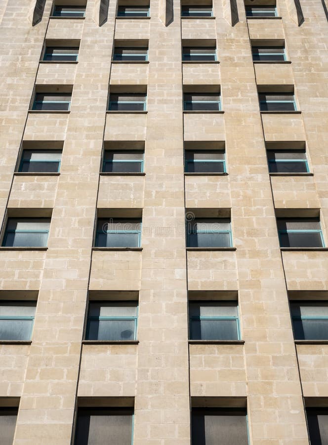 Front of a Building with Many Small Windows Stock Photo - Image of ...