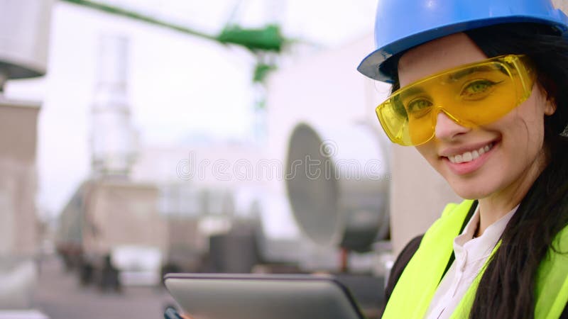 In Front of the Camera Attractive Lady Engineer Smiling Large on the ...