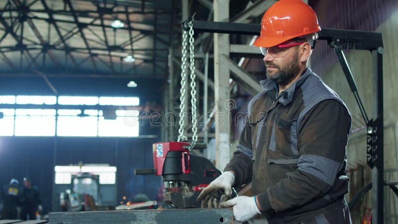 In Front of the Camera Factory Worker with Safety Equipment and Helmet ...