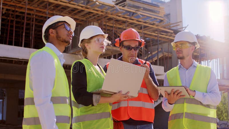 In Front of the Camera Group of Engineers and Architects in Front with ...