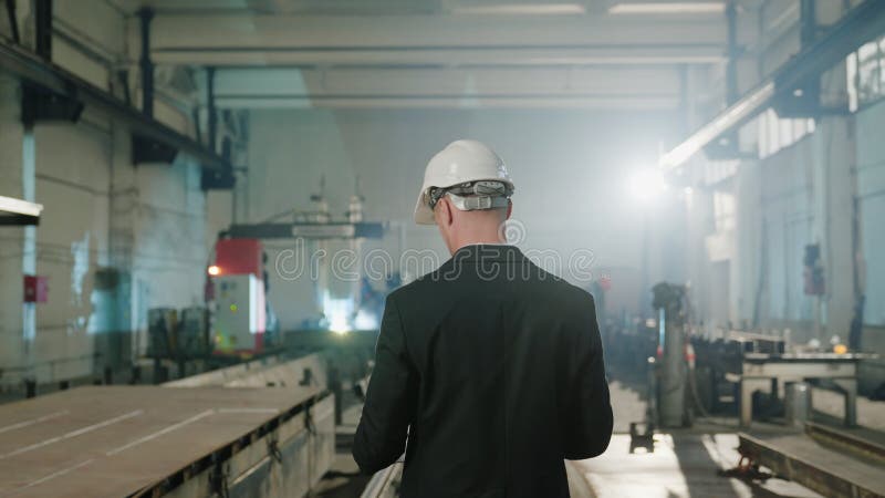 In Front of the Camera Taking Video from the Back of Main Manager with ...