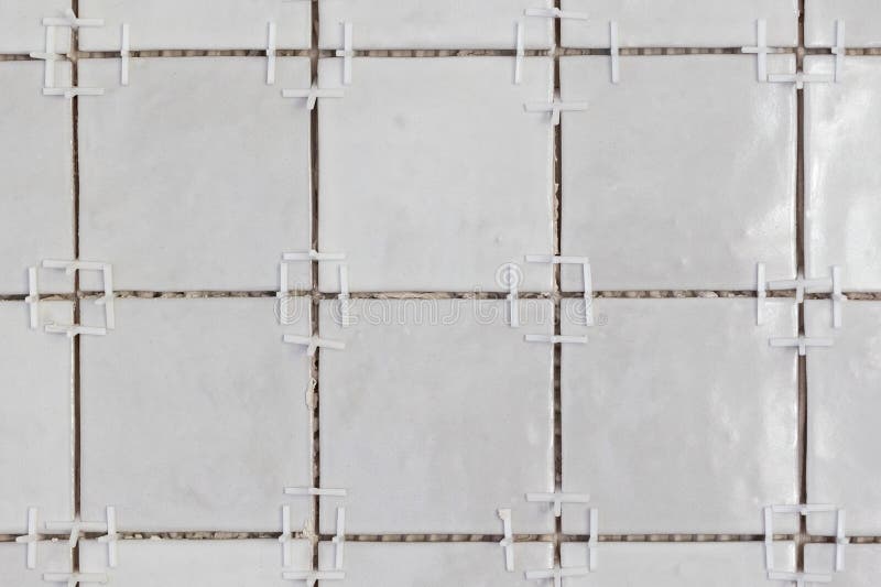 A Front Close Up of a Tile Wall Under Construction. the Wall is Being ...