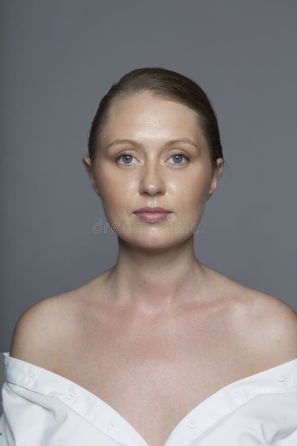 Closeup Portrait Of A Beautiful Woman With Natural Makeup And Tight