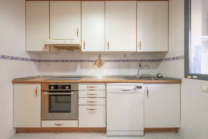 Front of a Conventional Kitchen with Light Wood Cabinets with ...