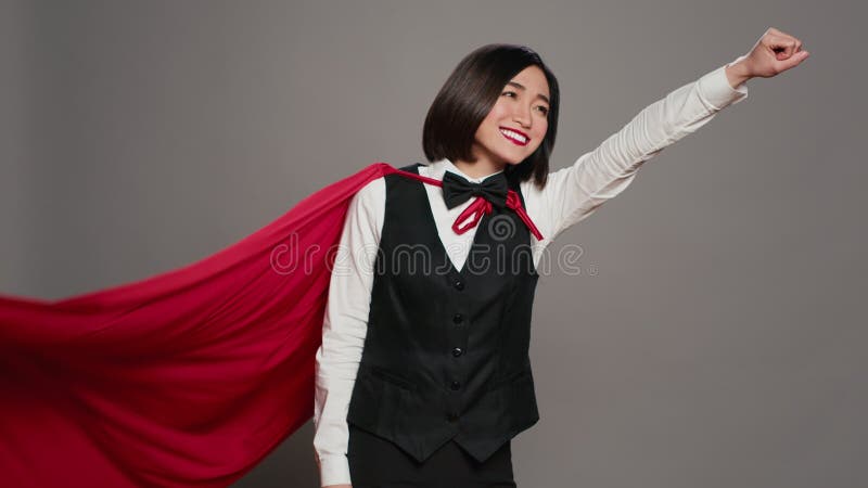 Front Desk Operator Feeling Strong with a Super Hero Cape on Camera ...