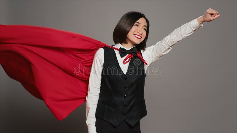 Front Desk Operator Feeling Strong with a Superhero Cape on Camera ...