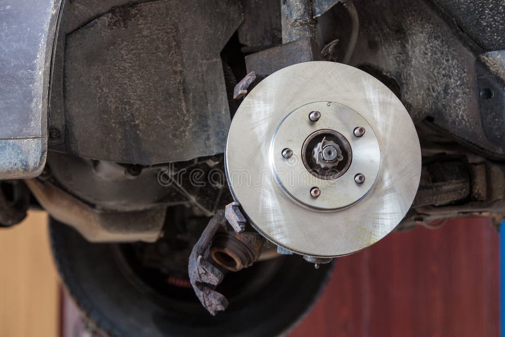 Front Disk Brake on Car in Process of Damaged Tyre Replacement. Stock ...