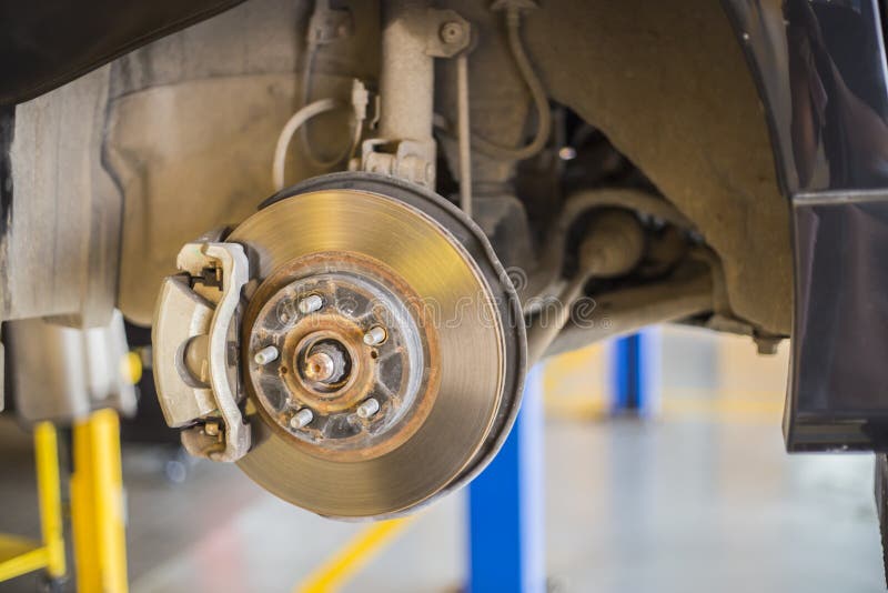 Front Disk Brake on Car in Process of Damaged Tyre Replacement Stock ...