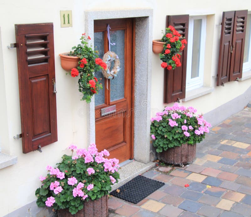 Front door with flowers stock image. Image of entryway - 146361839