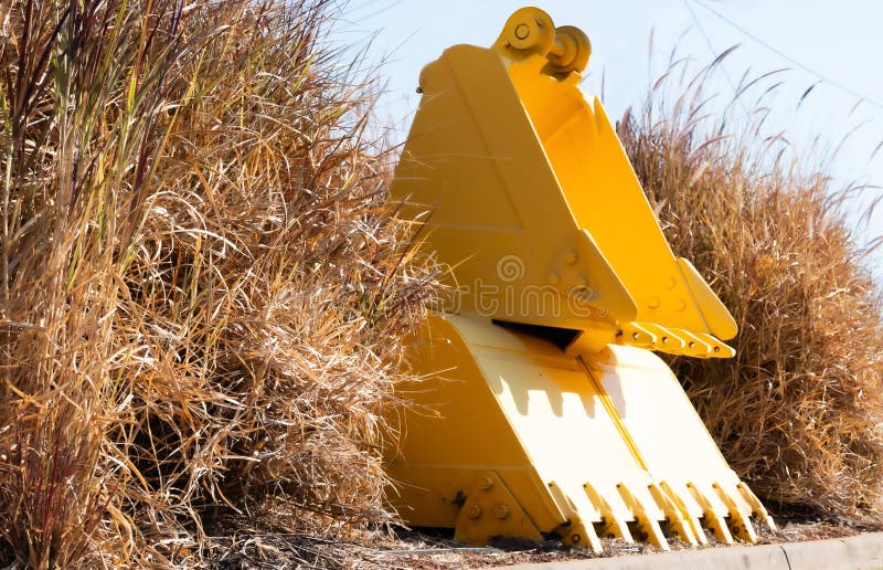 Front End Loader Buckets in Dry Grass Stock Image - Image of industrial ...