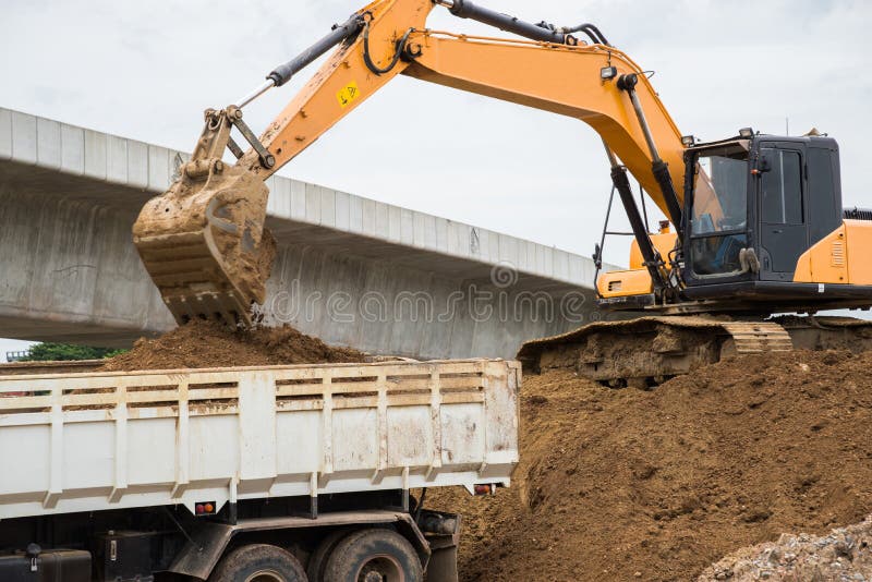 Front End Loader Dumping Stone in a Mining Quarry Stock Photo - Image ...
