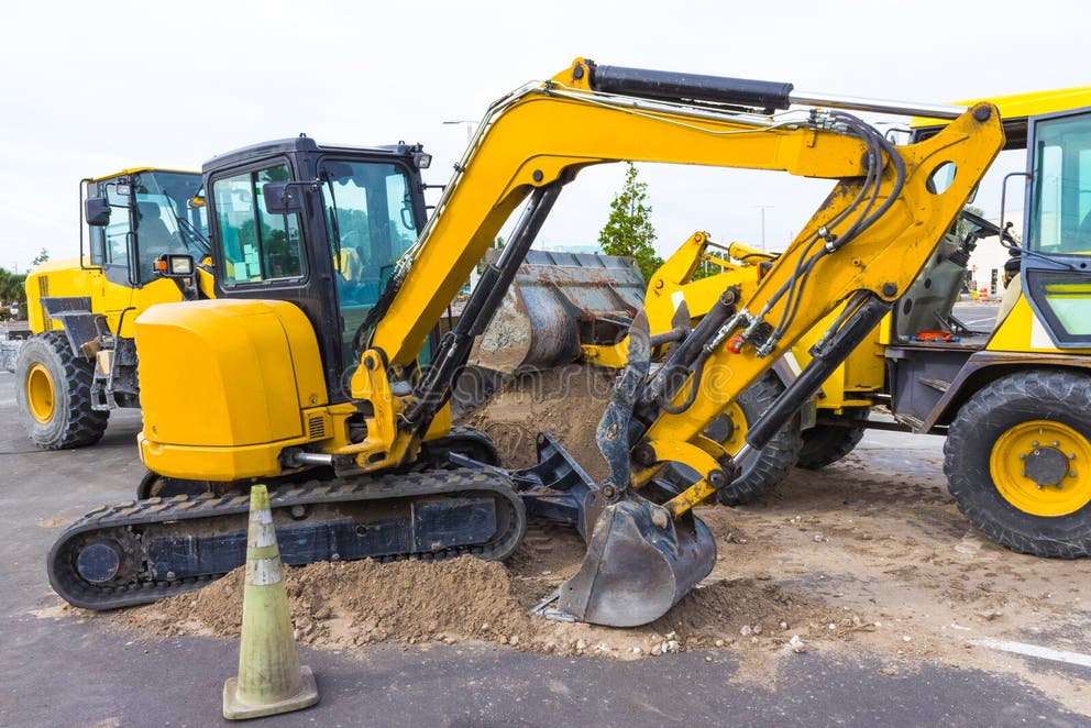 Front End Loader Dumping Stone and Sand in a Mining Quarry Stock Photo ...