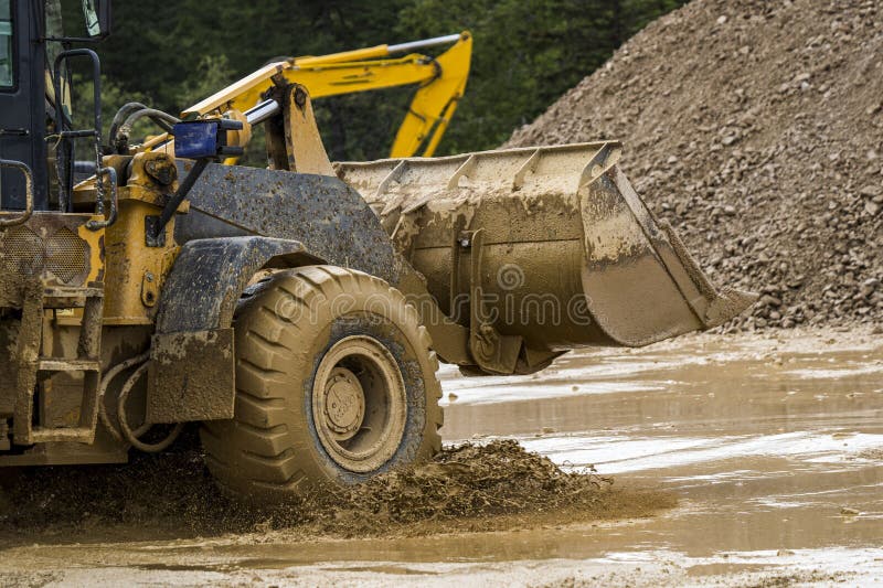 A Front End Loader Machine Tipping Sand in a Stock Image - Image of ...