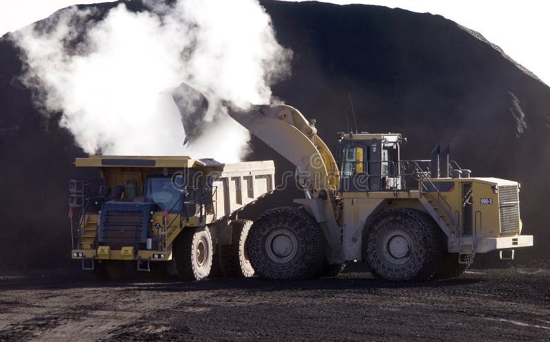 Front End Loader Loading Dump Truck Stock Photo - Image of front ... Front End Loader Loading Dump Truck Stock Photo - Image of front ...