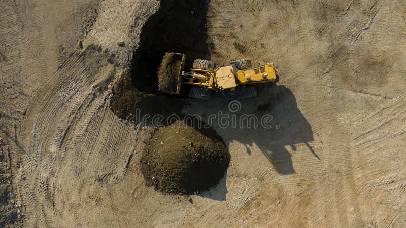 A Front End Loader Machine Tipping Sand in a Stock Image - Image of ...