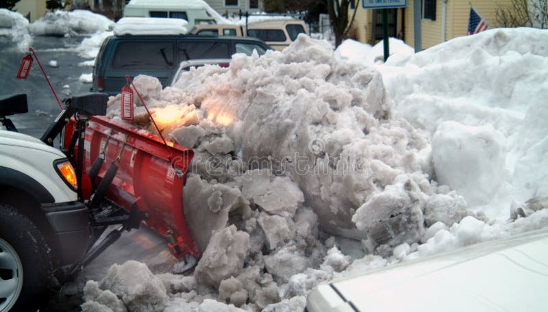 A Front End Loader Plows a Mountain of Snow after a 24 Hour Snowfall ...