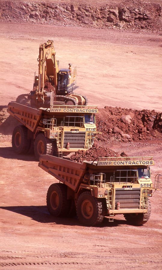Front End Loaders and Dump Trucks Moving Ore Editorial Image - Image of ...