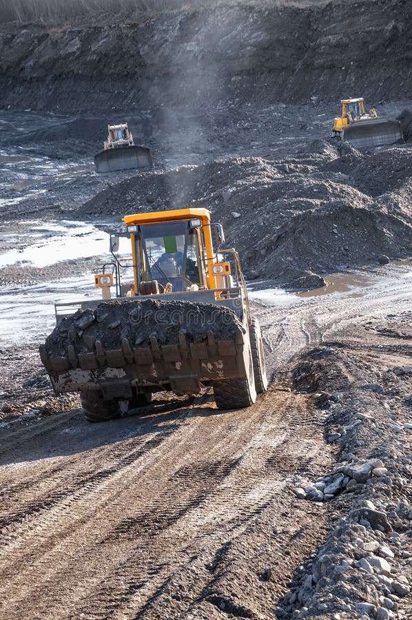 Front-end Wheel Loader and Bulldozers in Operation. Stock Photo - Image ...