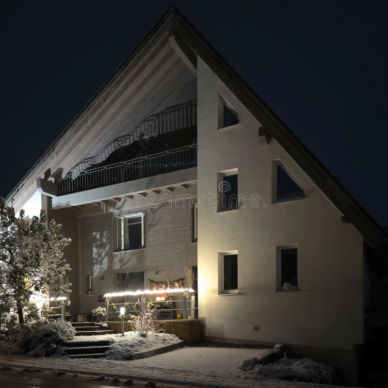 Front Facade of an Illuminated House with Interesting Decorations ...
