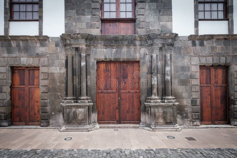 Front of Historic Building Facade with Wooden Doors Stock Image - Image ...