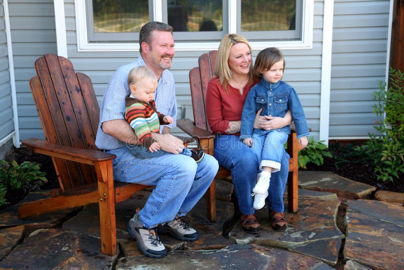 Family in front of home stock image. Image of mother, canine - 4029743