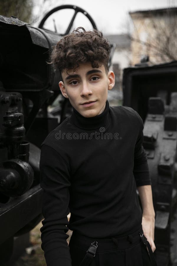 Front Image of Young Trendy Guy Dressed in a Black Clothes, Posing with ...
