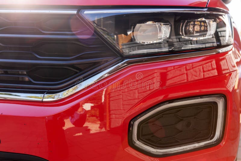 Front Light of a New Red Car Stock Photo - Image of detail, closeup ...