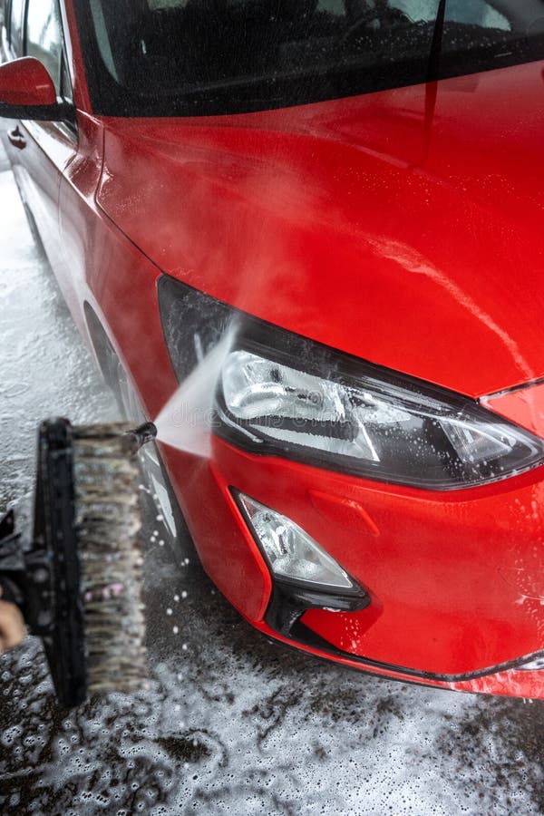 Front Lights of a Red Car Being Washed.. Stock Image - Image of closeup ...