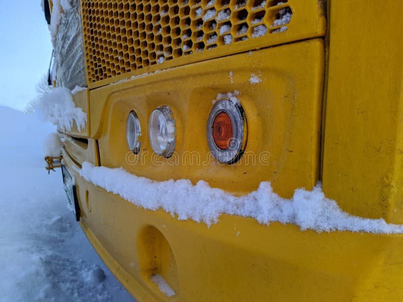 The Front Lights of a Yellow School Bus in the Winter Season. Stock ...